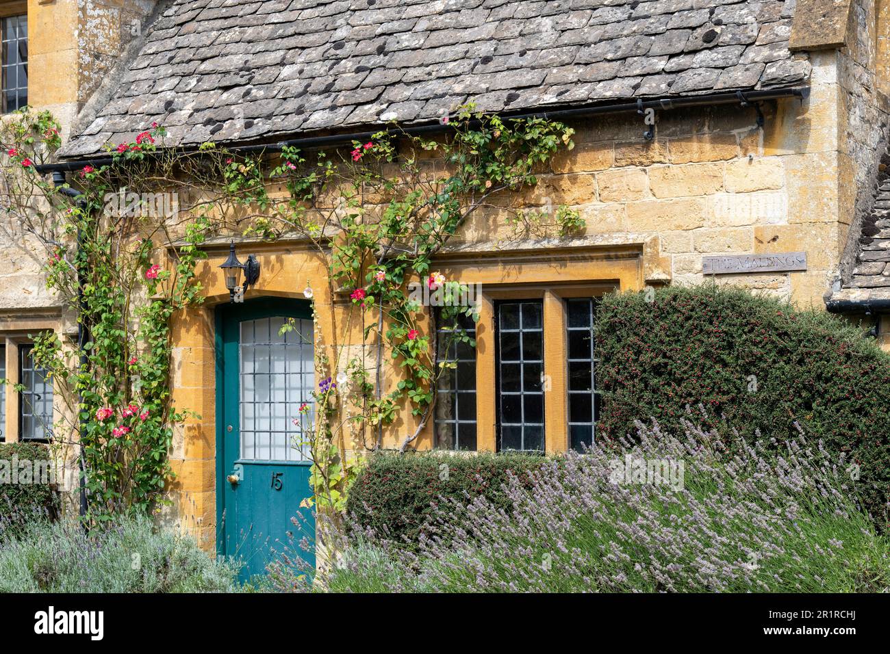 Broadway, UK-August 2022; Close up view of the flower overgrwon façade ...