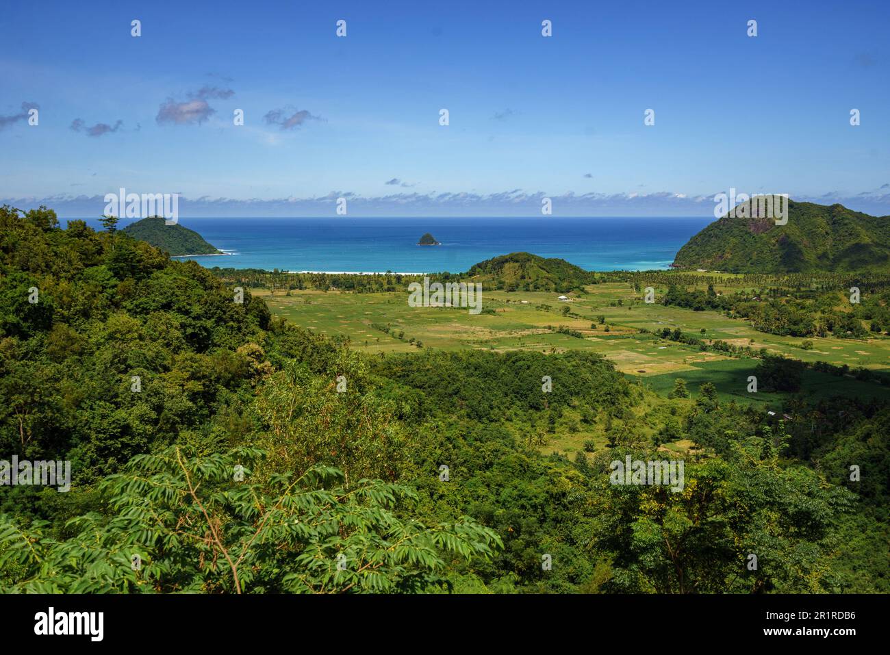 Lush rural landscape with Selong belanak beach in distance, Lombok ...