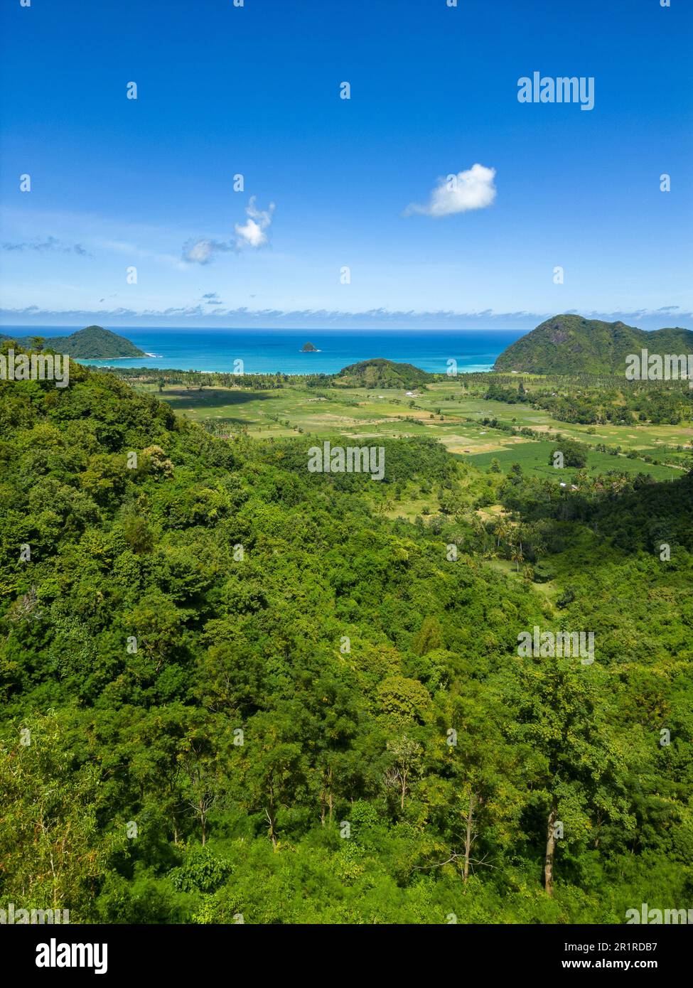 Lush rural landscape with Selong belanak beach in distance, Lombok ...