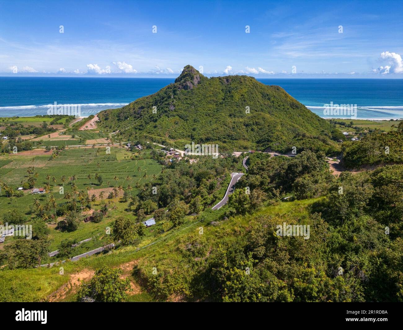 Lush rural landscape with Selong belanak beach in distance, Lombok ...