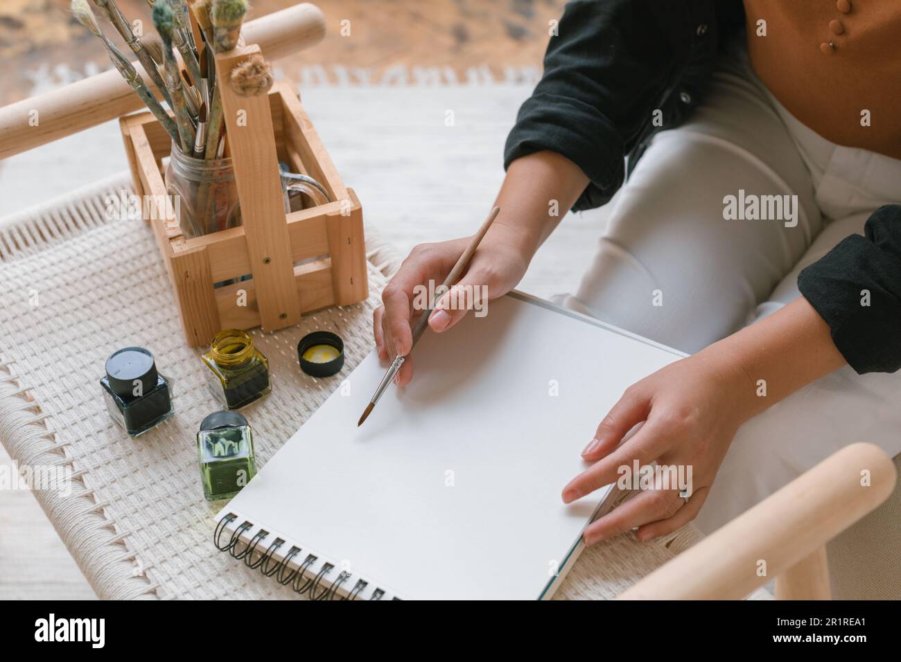 Overhead view of a woman painting with watercolour paints Stock Photo ...