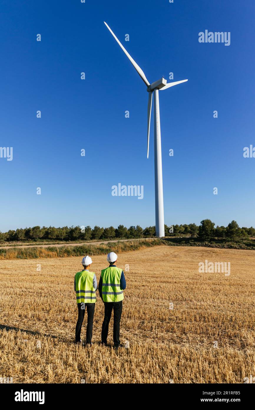 Engineers working in a wind turbine field Stock Photo - Alamy