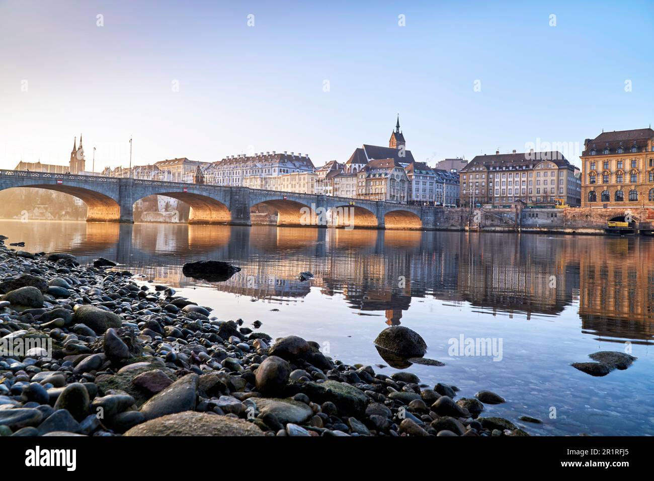 Early morning in Basel at the middle bridge, the arches of which are ...