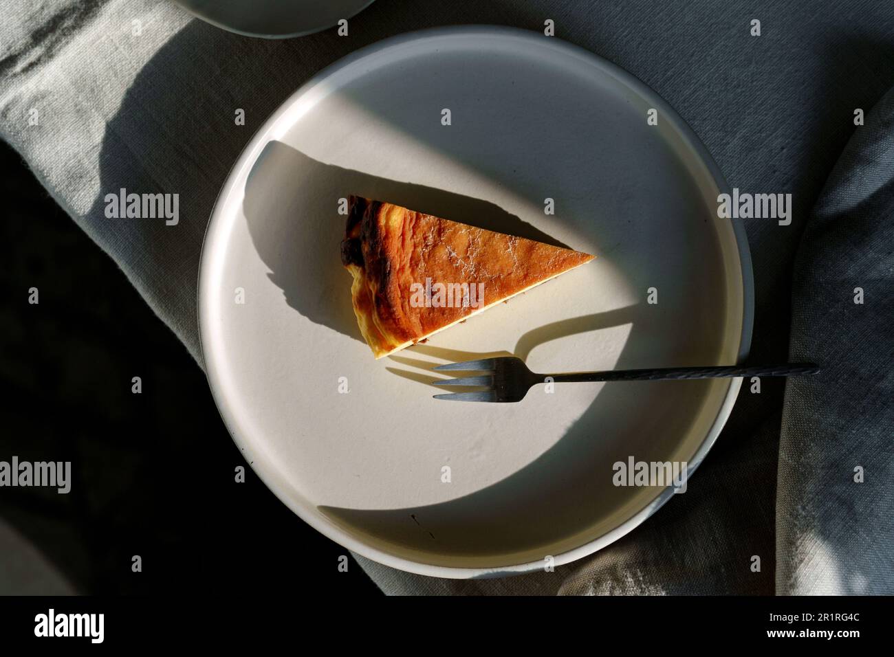 Overhead view of a Slice of Basque Burnt Cheesecake on a plate Stock ...