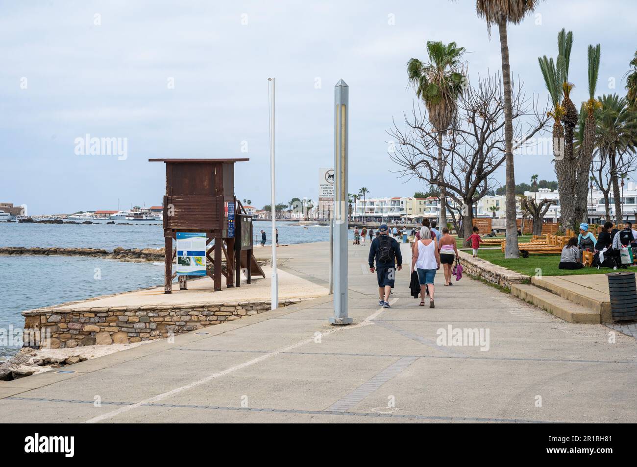Paphos, Cyprus - March 27, 2023 - People walking the beach boulevard at ...