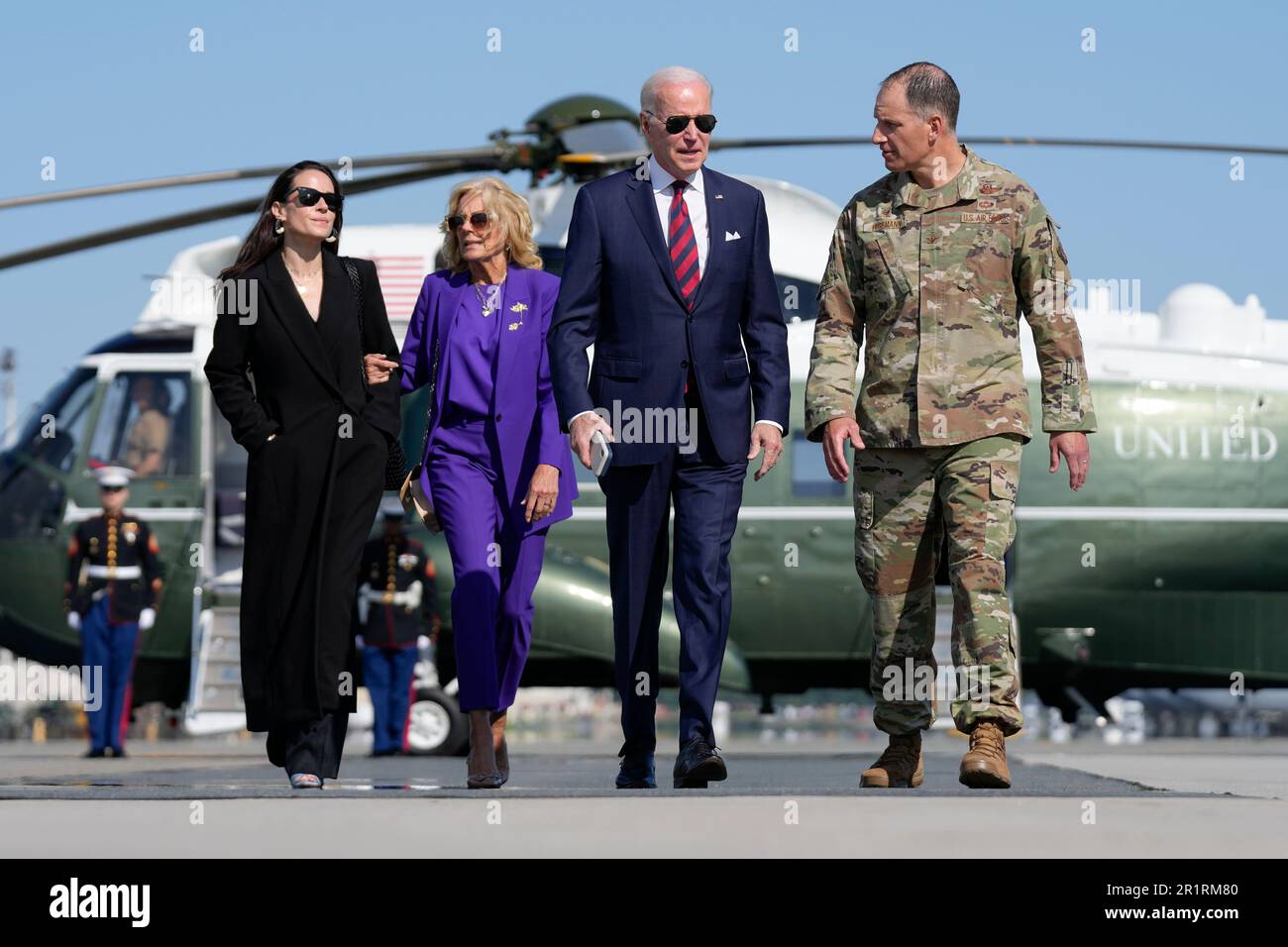 President Joe Biden speaks with U.S. Air Force Col. Matthew Huseman ...