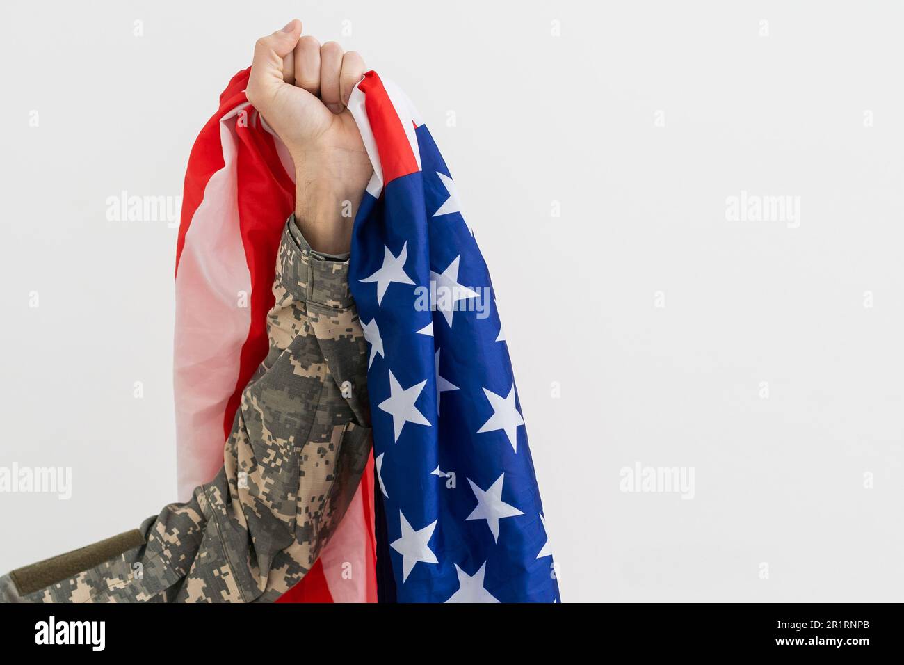 Army soldier holding stars and stripes national flag hi-res stock ...