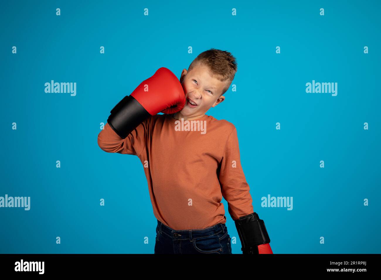 Crazy Sports. Funny Little Boy Wearing Boxing Gloves Punching His Own ...