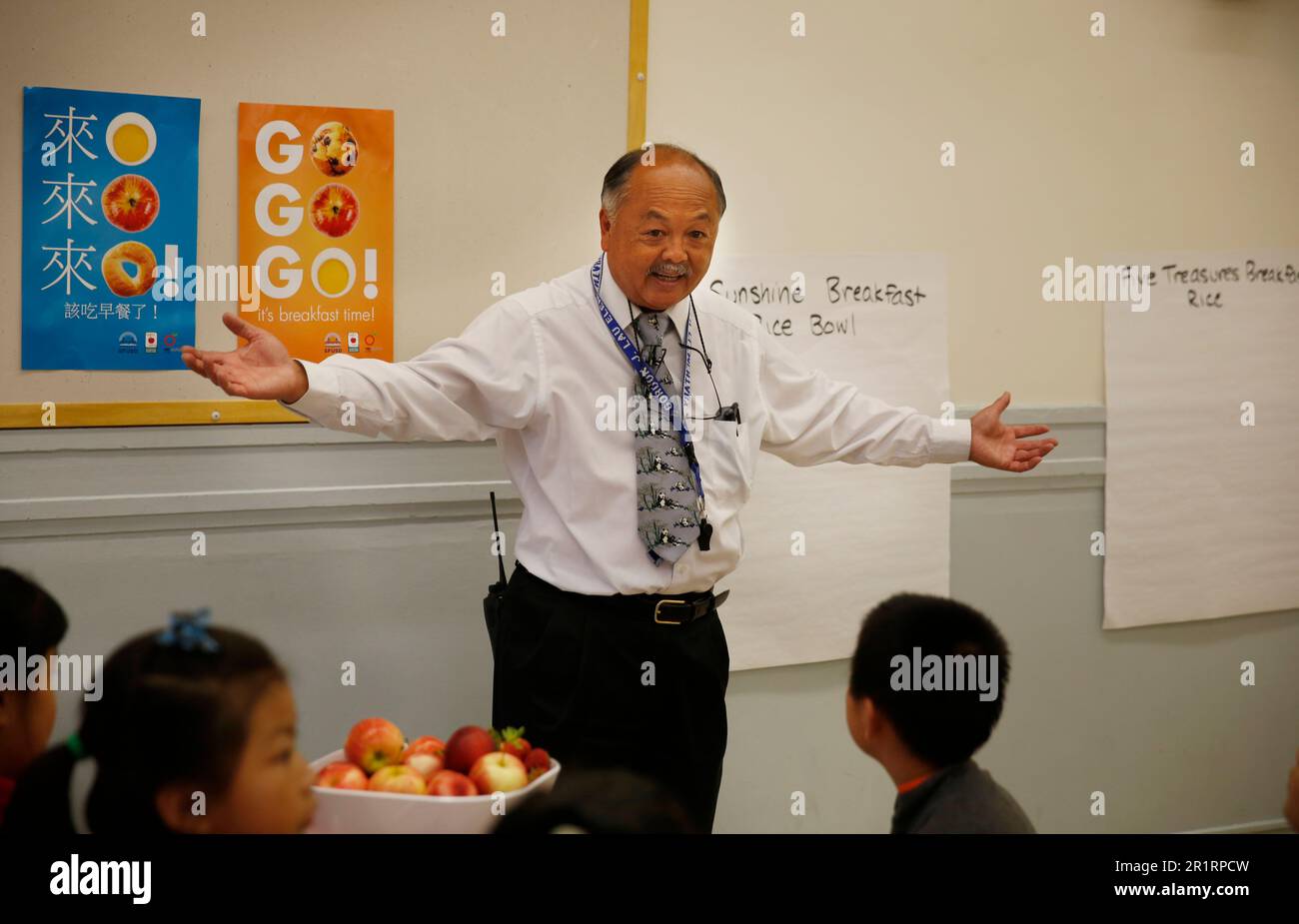 Dr. Dennis Chew, principal Gordon J. Lau Elementary School , talks with students before the ...