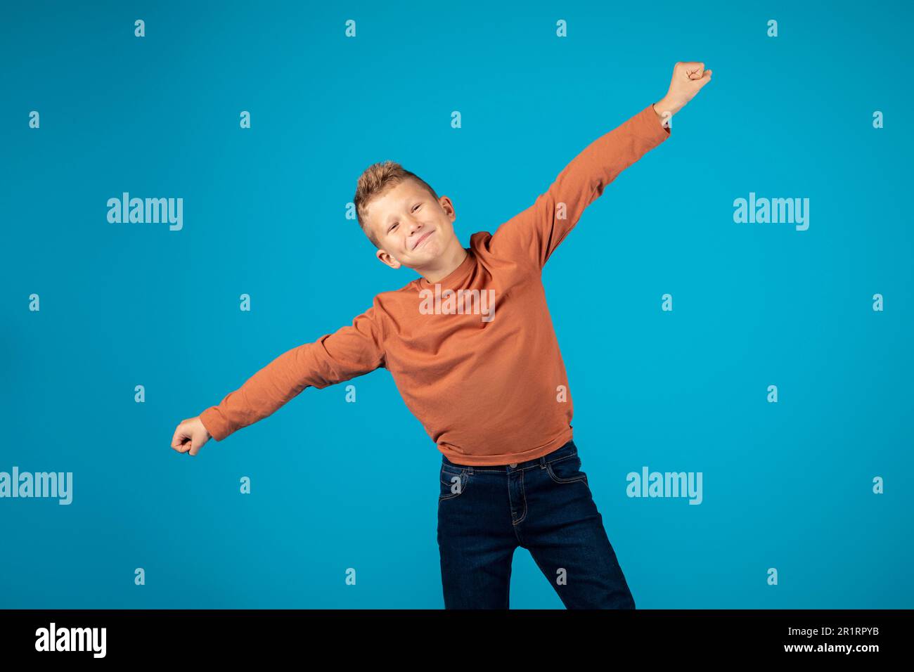 Portrait Of Funny Little Boy Spreading Arms And Pretending Flying Stock ...