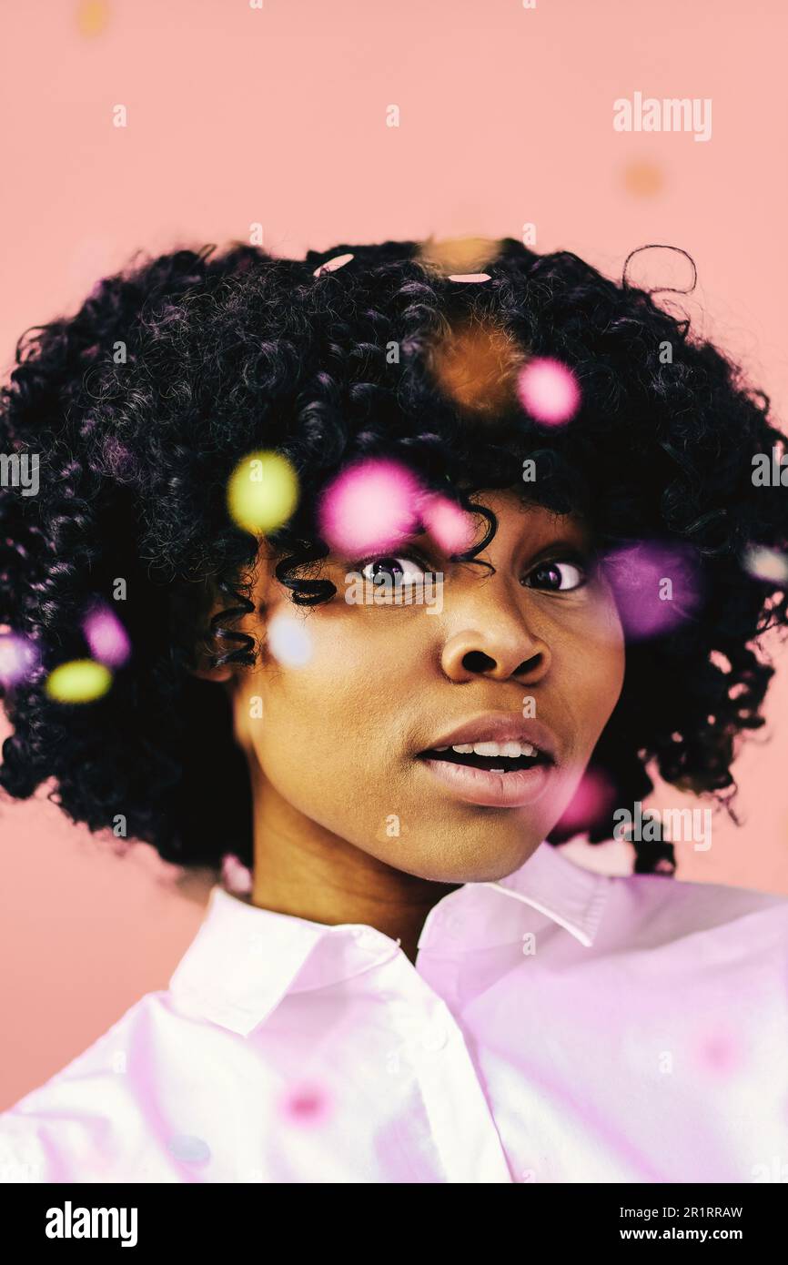 close up woman under confetti shower studio shot Stock Photo - Alamy