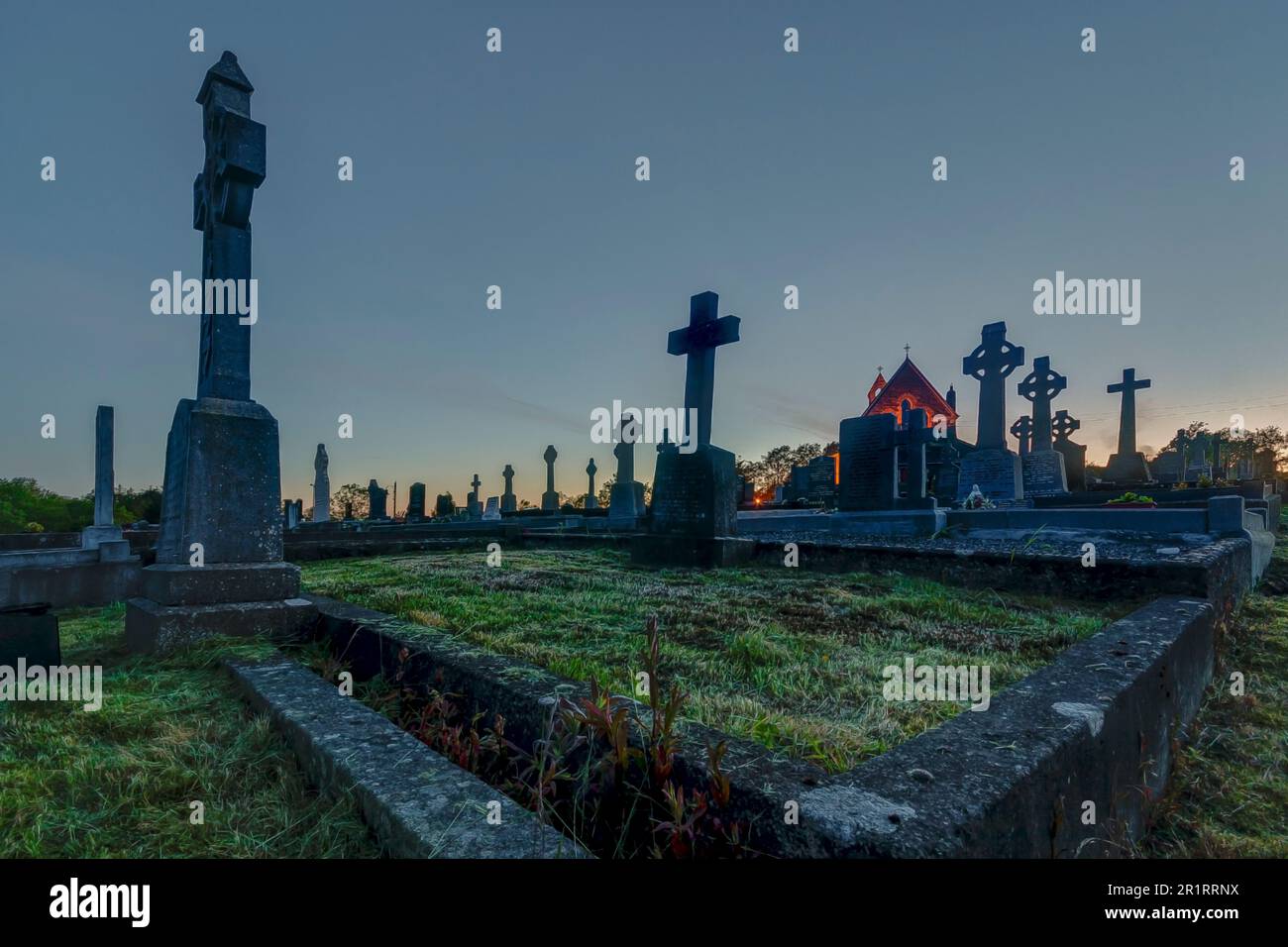 Picture of an old cemetery in Ireland at dusk from a ground perspective ...