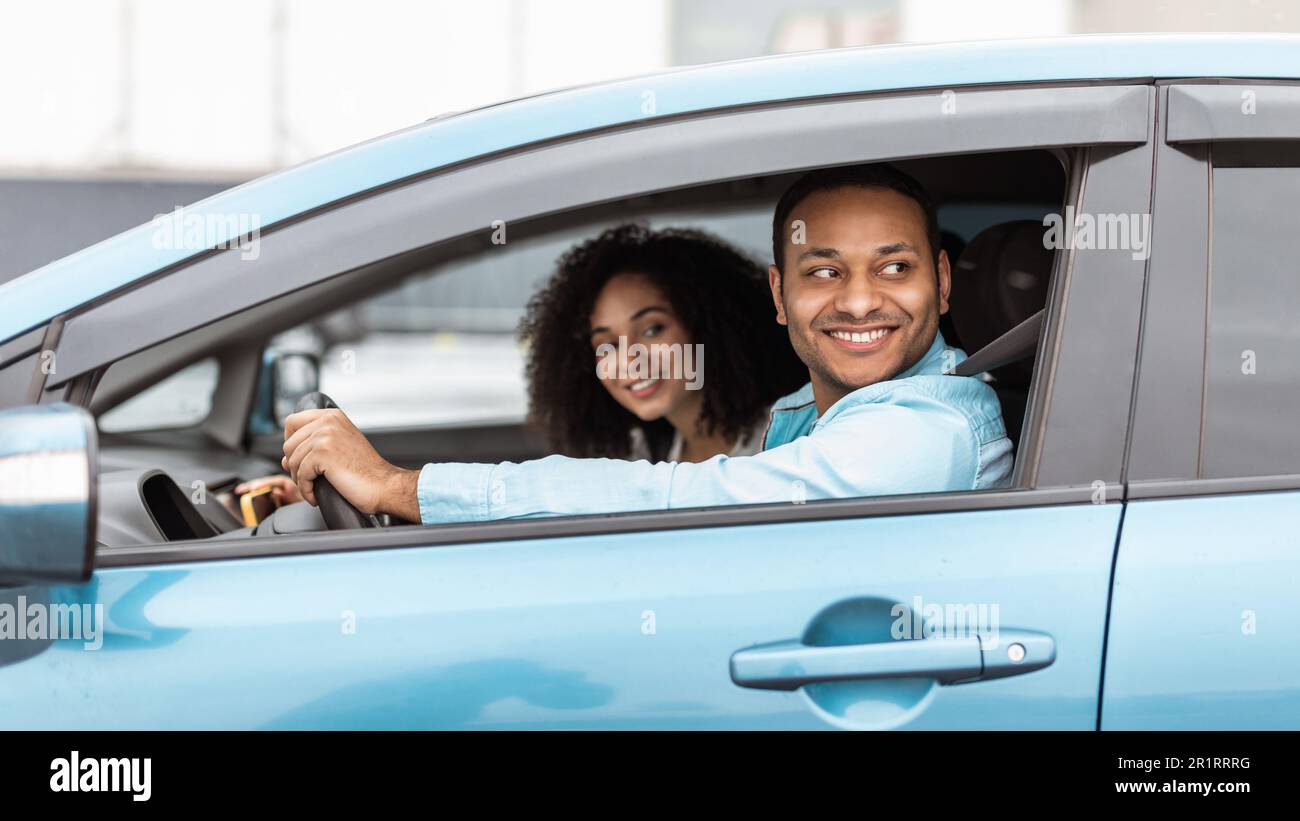 Side View Shot Of Cheerful Arab Couple Driving New Car Stock Photo - Alamy