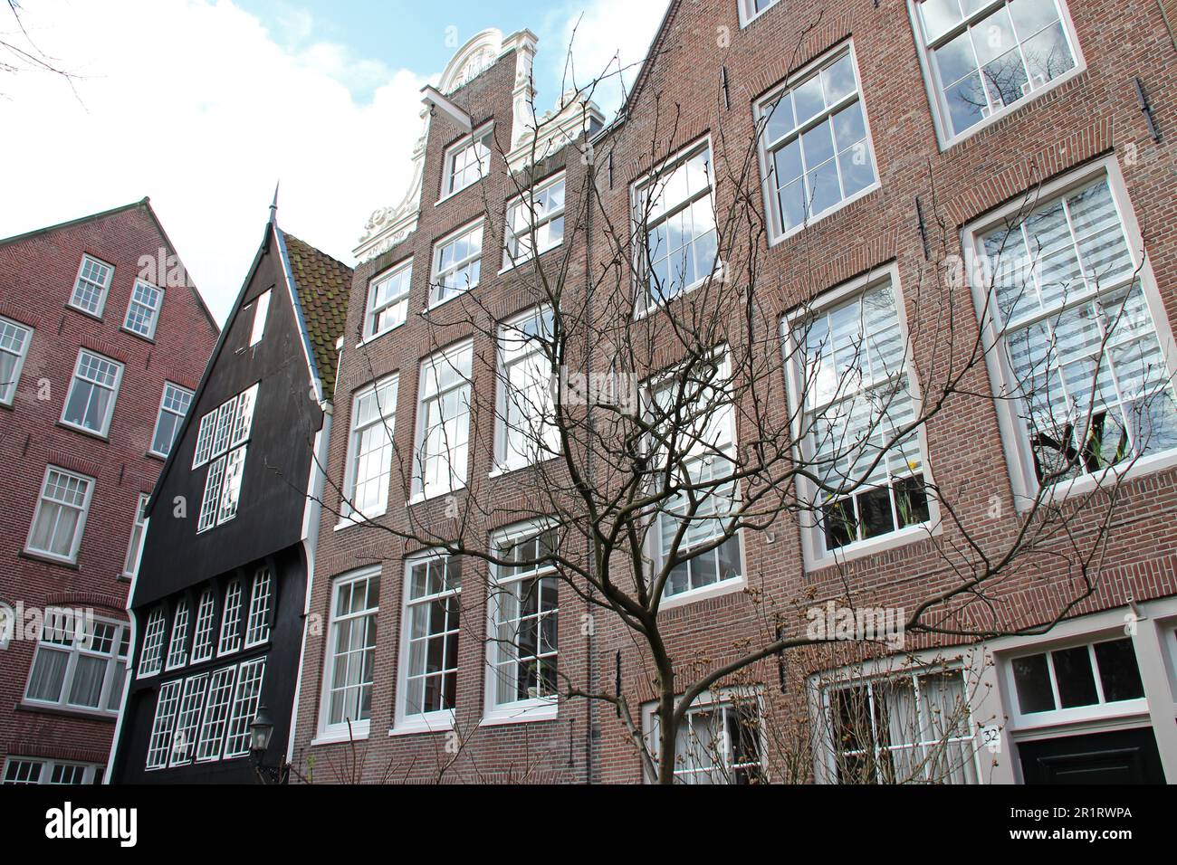 old brick houses at a beguinage (begijnhof) in amsterdam (the ...