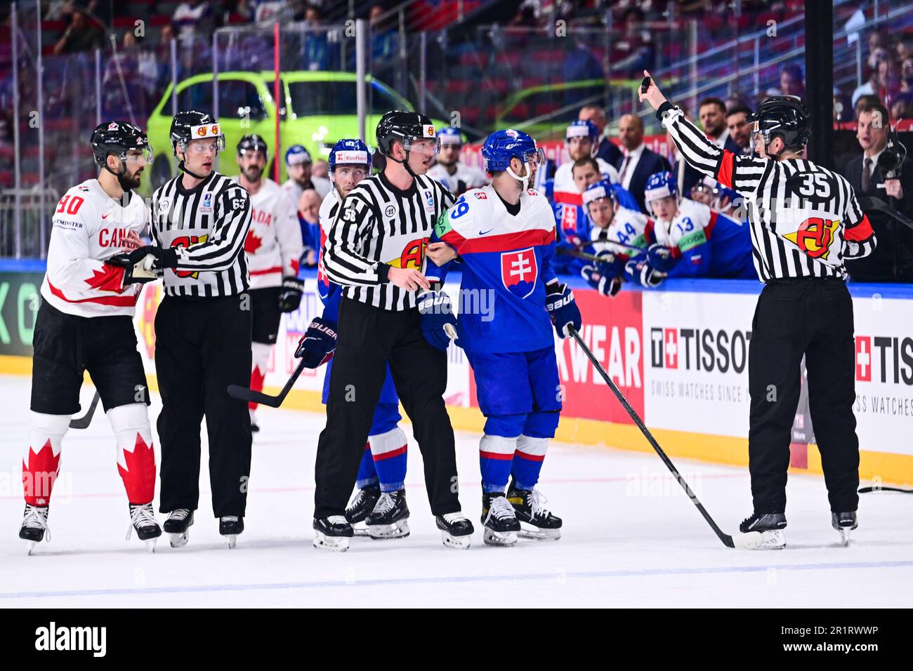Riga, Latvia. 15th May, 2023. L-R Joe Veleno (CAN), referees and Libor ...