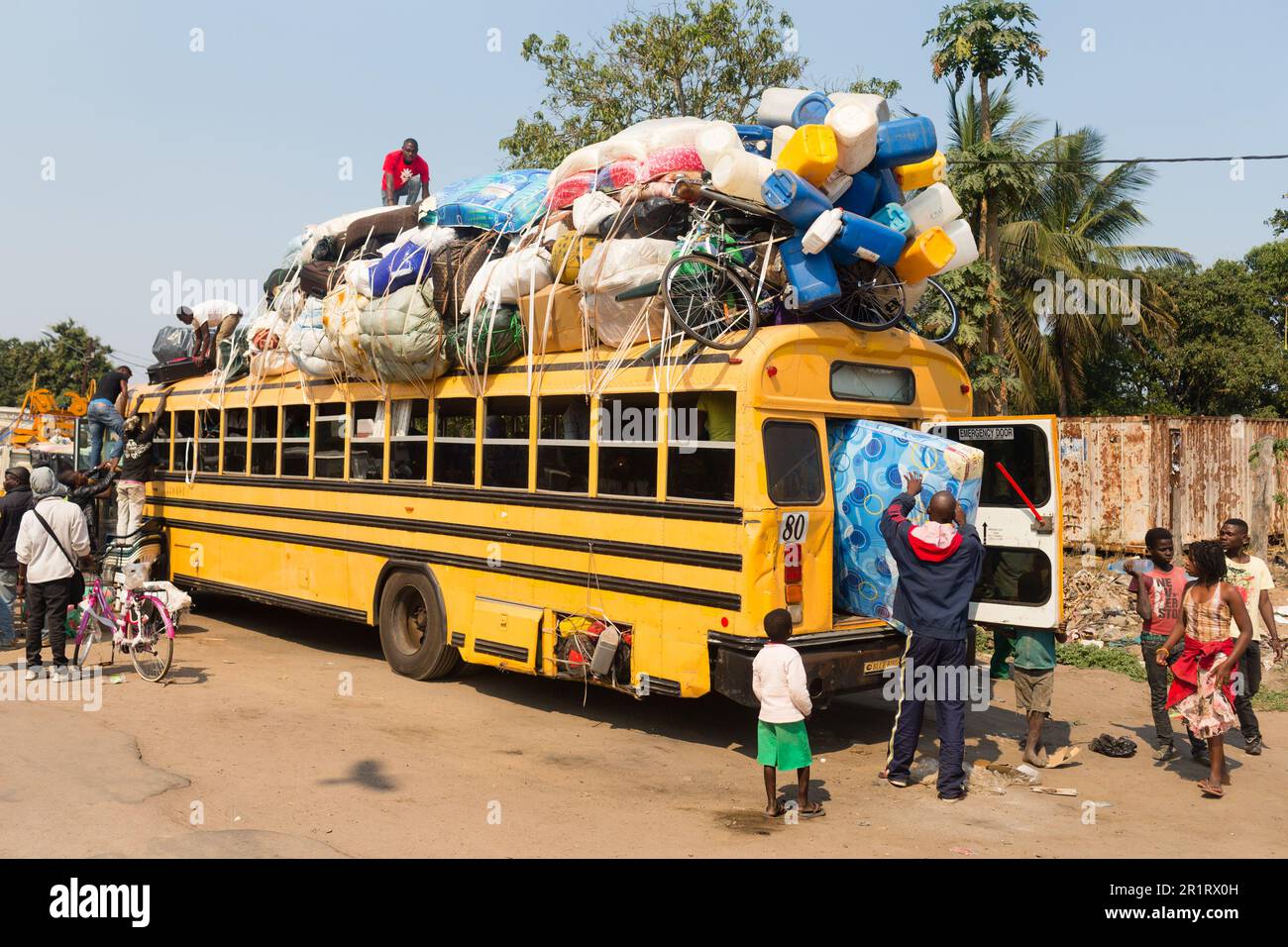 A mattress being loaded onto a crowded bus Morrumbala Mozambique Stock ...