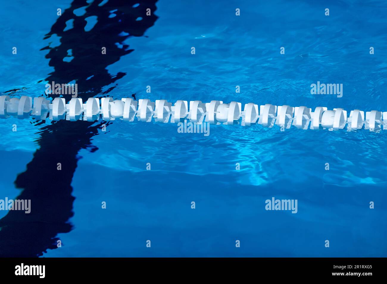 The view of an empty public swimming pool indoors. Lanes of a ...