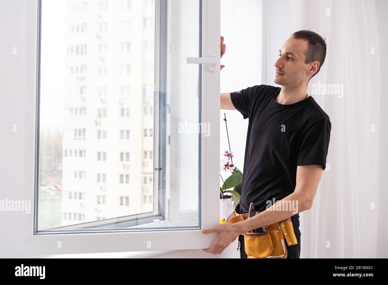 Worker in installing rubber seals on plastic upvc window Stock Photo ...