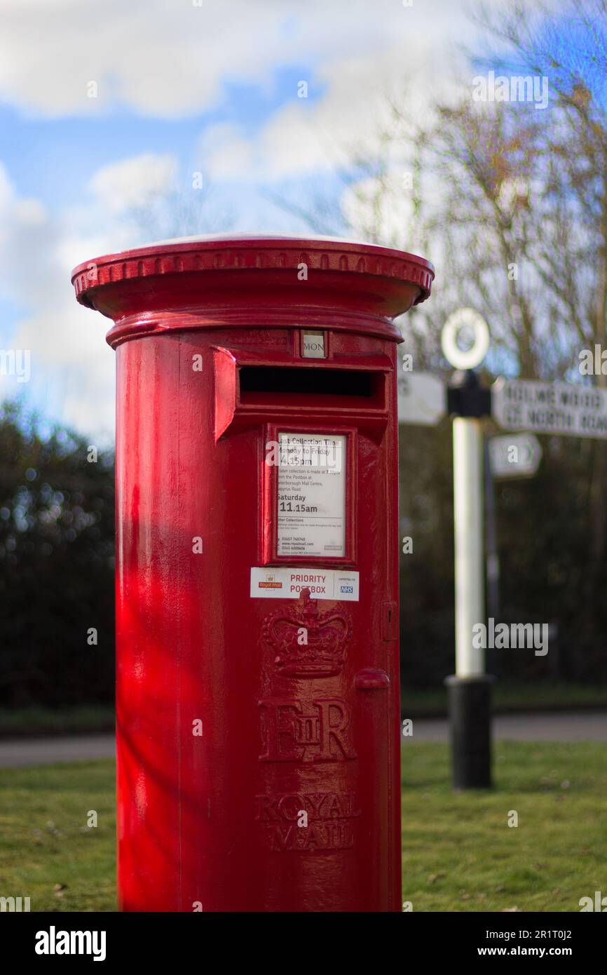 A classic red English post box in a rural setting Stock Photo - Alamy