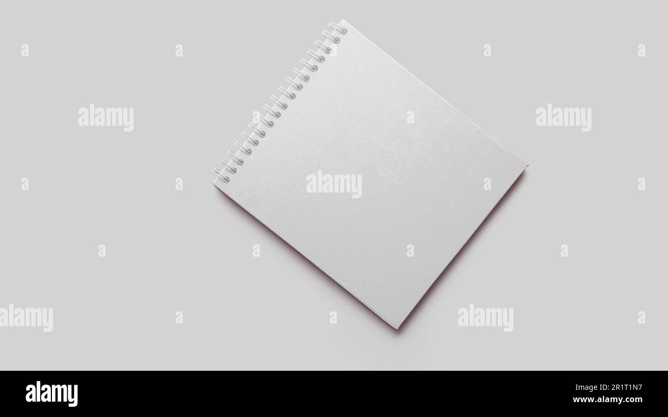 Empty white notebook mockup with soft shadows on neutral grey concrete ...