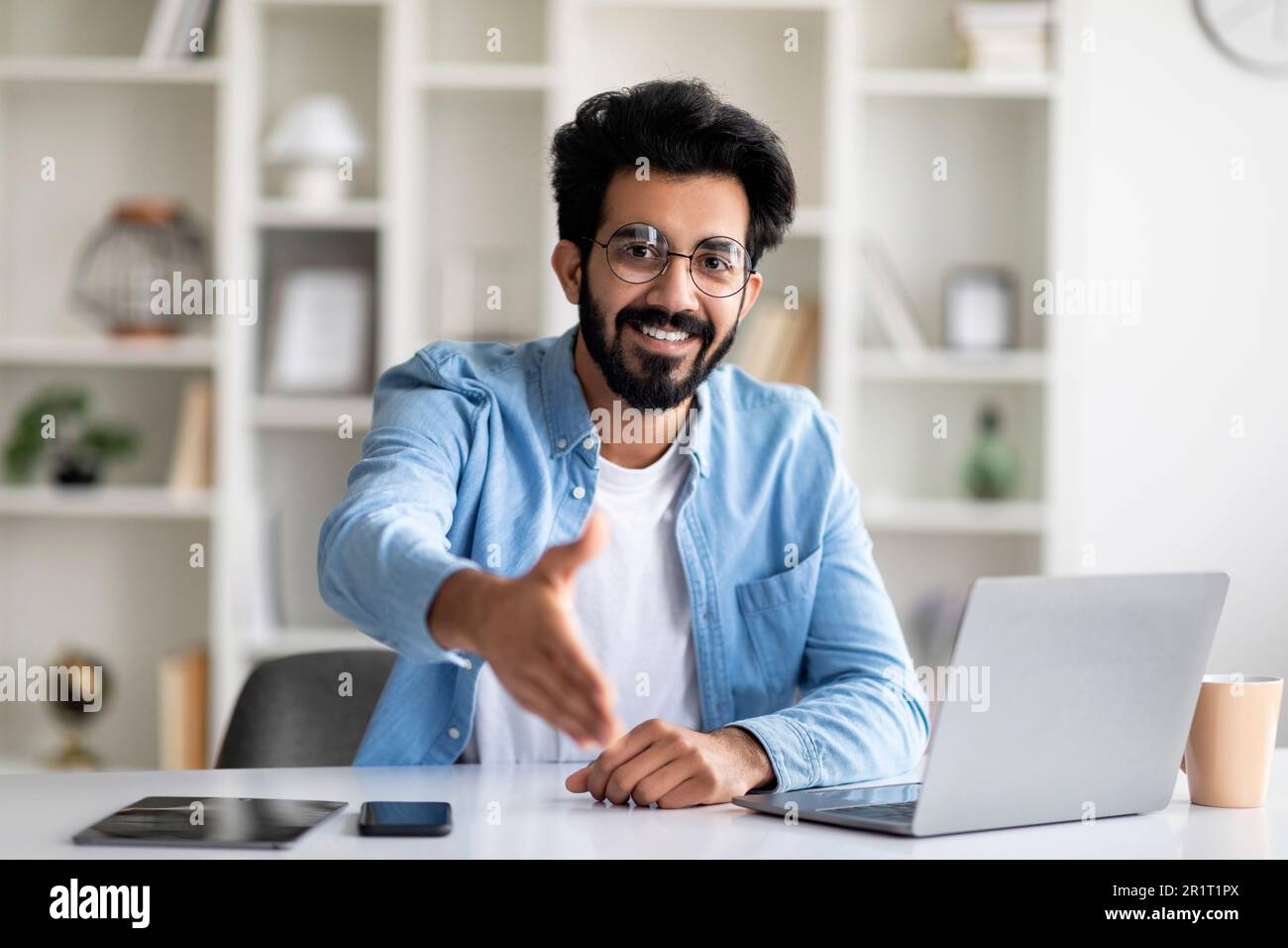 Hr manager extending hand hi-res stock photography and images - Alamy