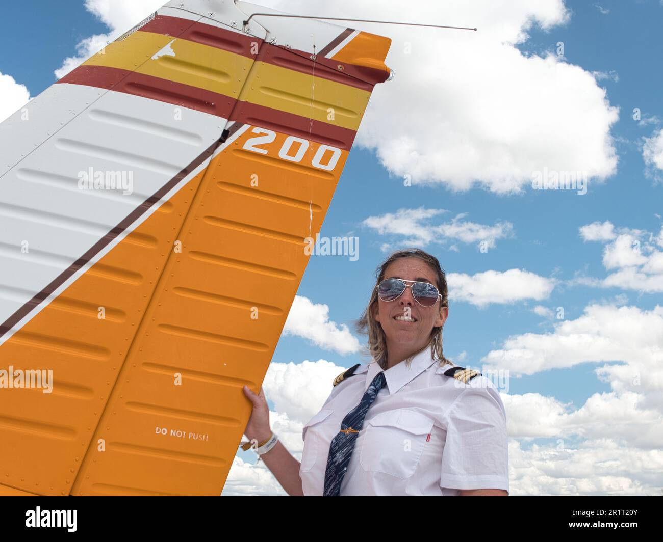 A Caucasian female pilot posing near her airplane Stock Photo - Alamy