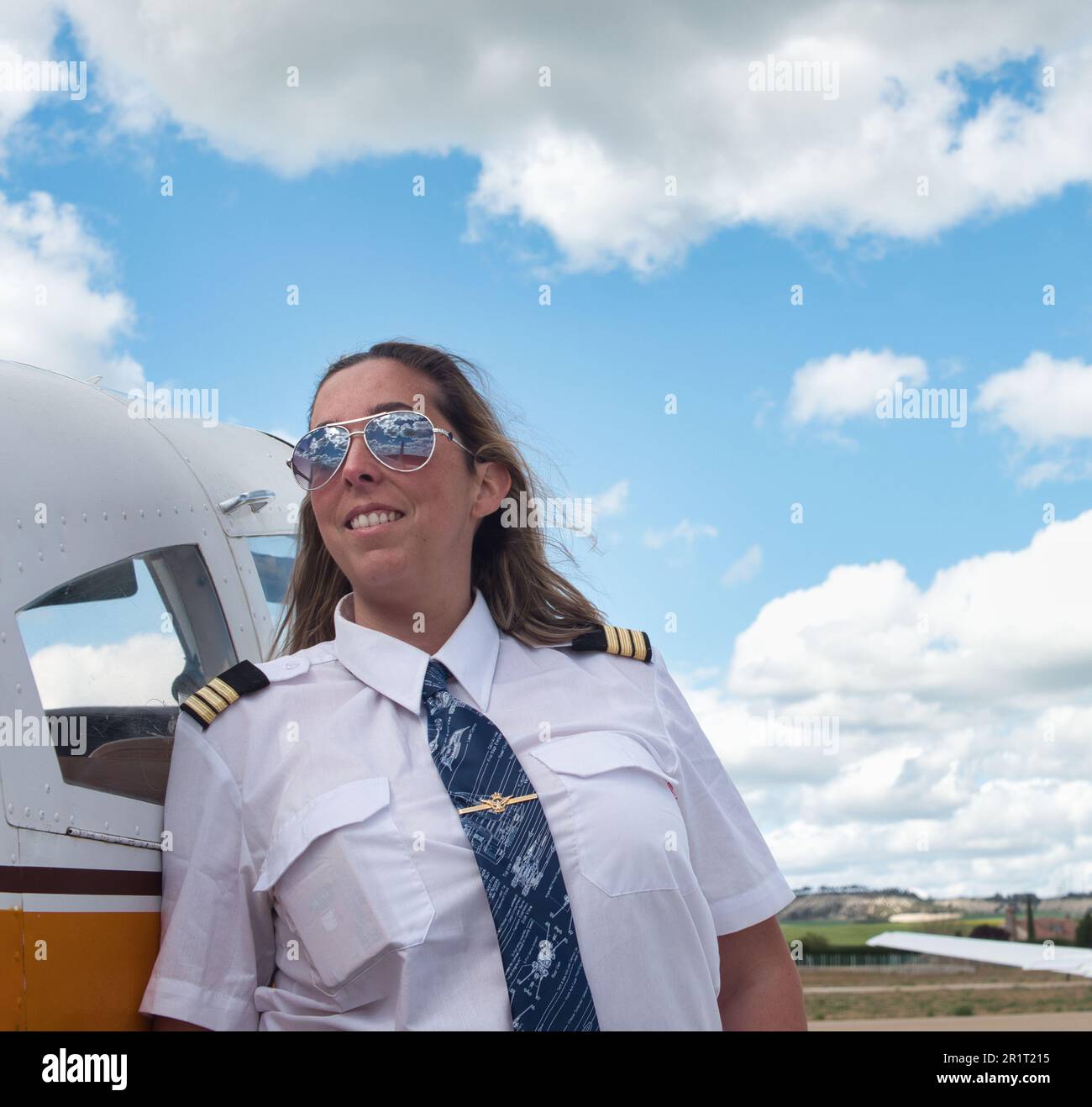 A Caucasian female pilot posing near her airplane Stock Photo - Alamy