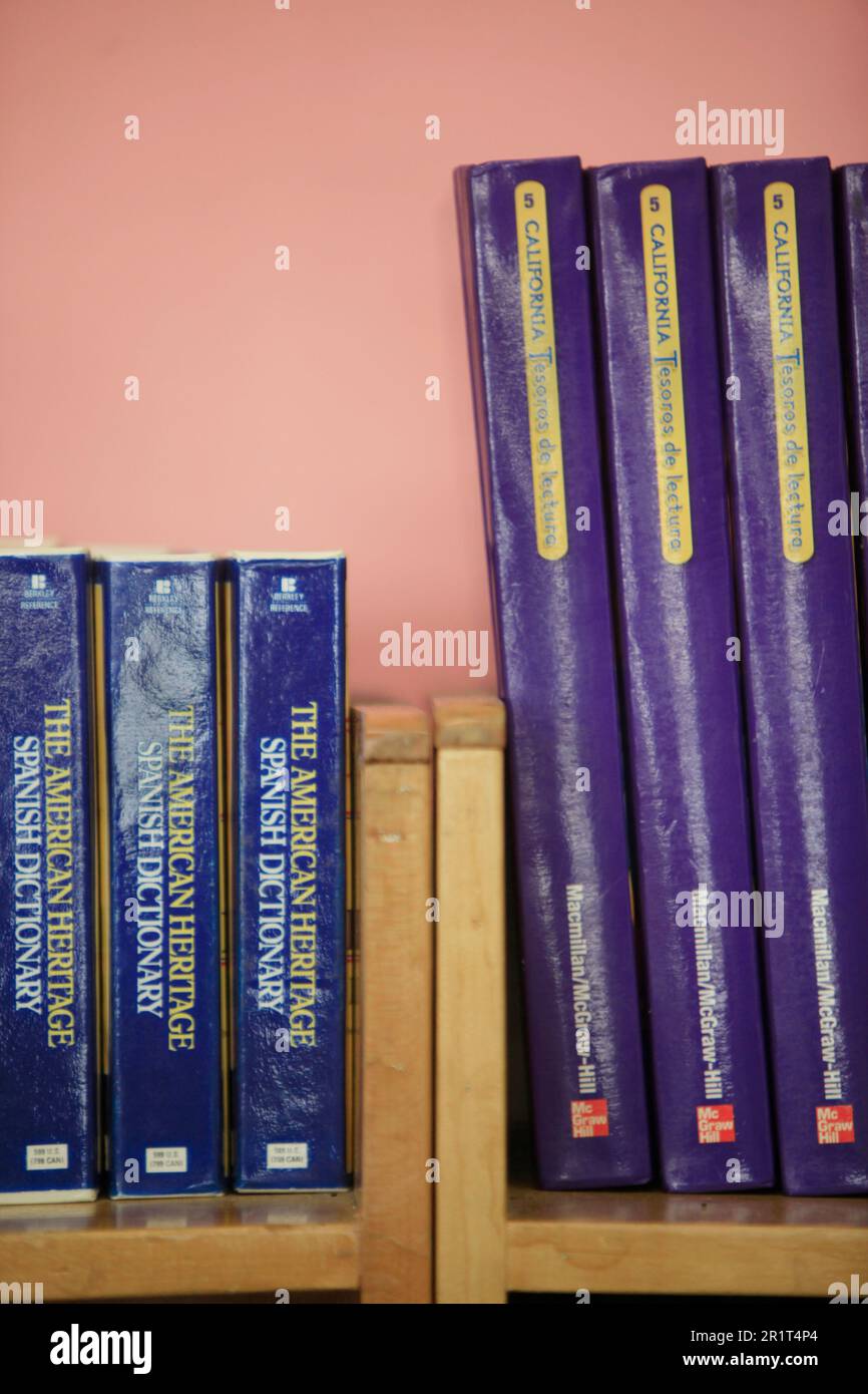 Spanish dictionaries and textbooks in Spanish sit on a shelf in Mission ...