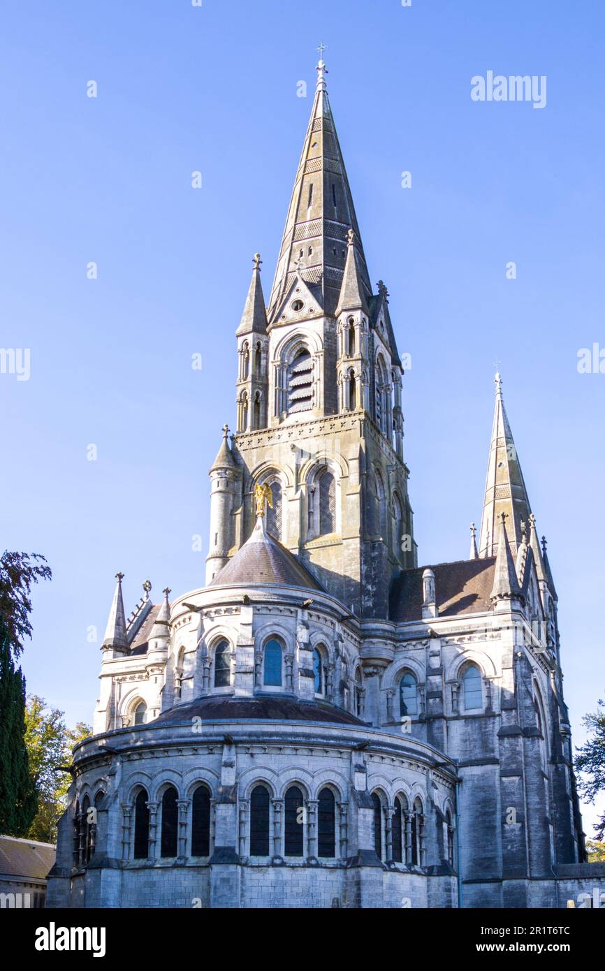 The tall Gothic spire of an Anglican church in Cork, Ireland. Neo ...