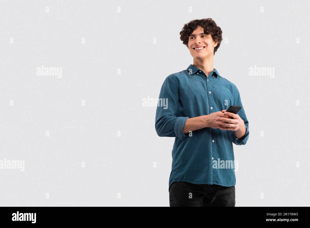 Guy Browsing Social Media On Smartphone Standing On White Background ...