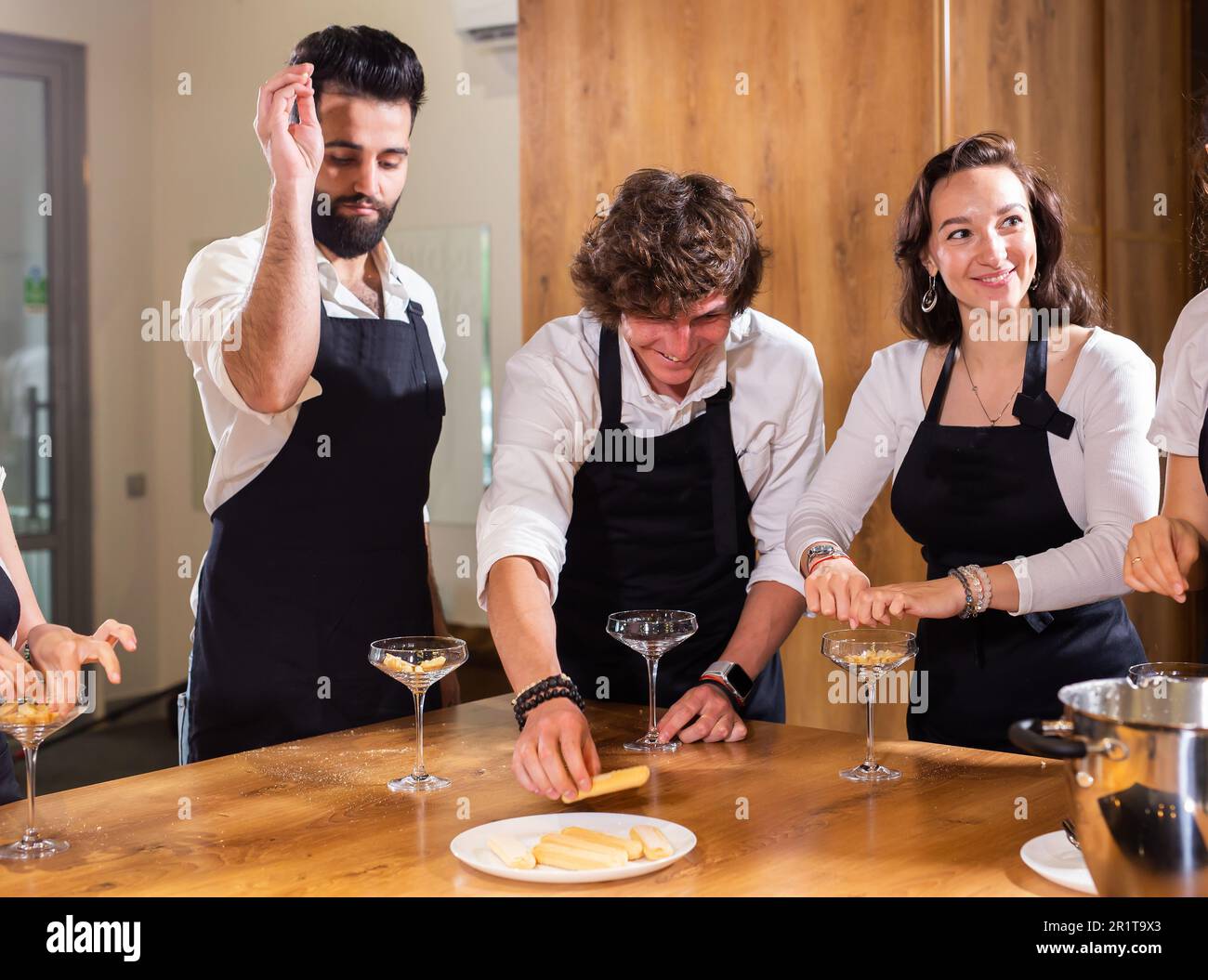 Chef teaching trainees how to make ice cream. Cooking tasty ice cream ...