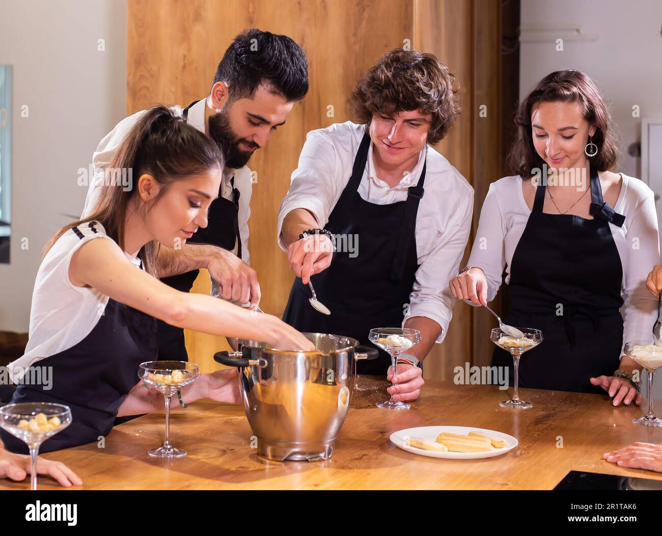 Chef teaching trainees how to make ice cream. Cooking tasty ice cream ...