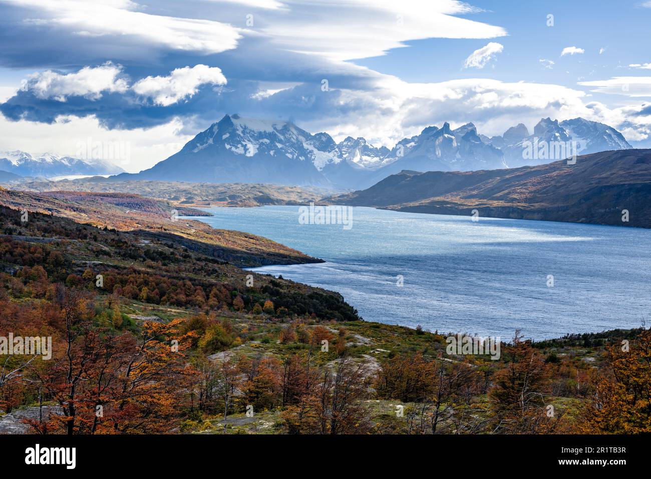 A tranquil lake surrounded by majestic mountains. Torres del Paine, Chile, Patagonia Stock Photo ...