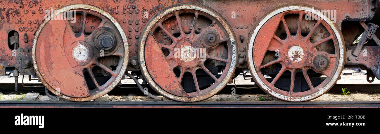 Rusty red wheels of very old obsolete steam locomotive Stock Photo - Alamy