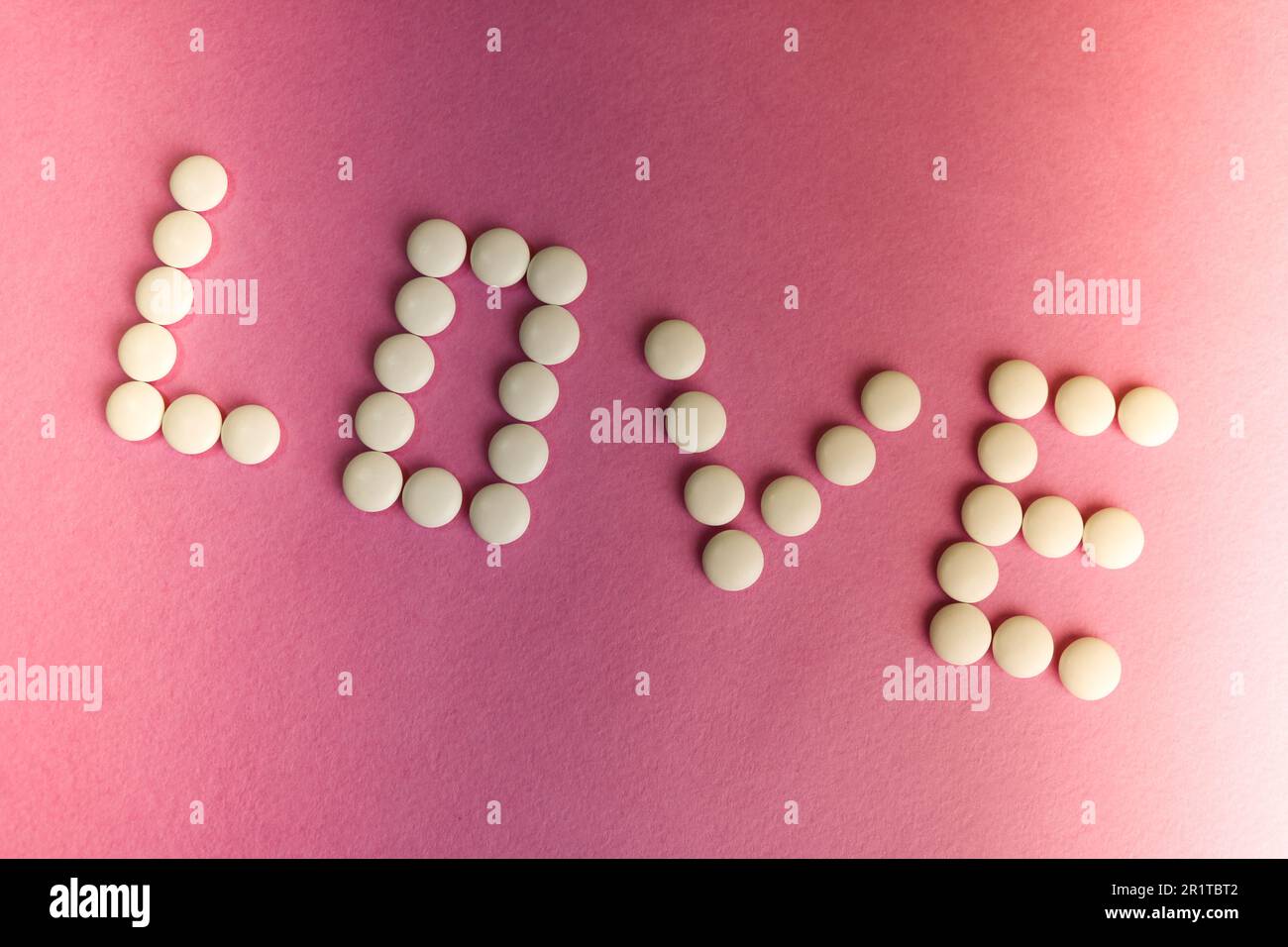 Beautiful inscription love made from white round smooth medical pills ...