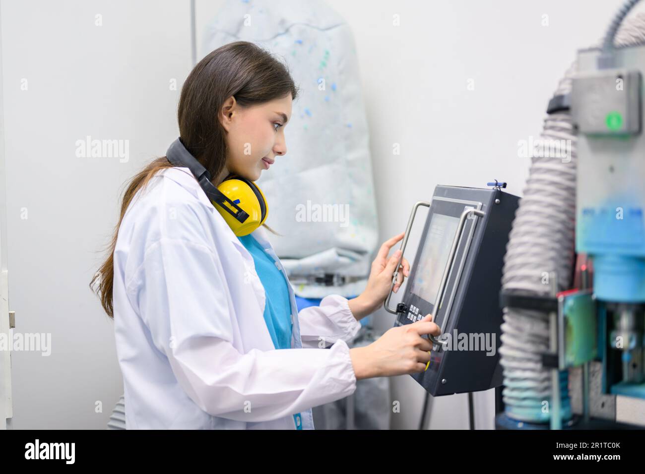Technician making prosthetic device using grinder to smooth socket ...