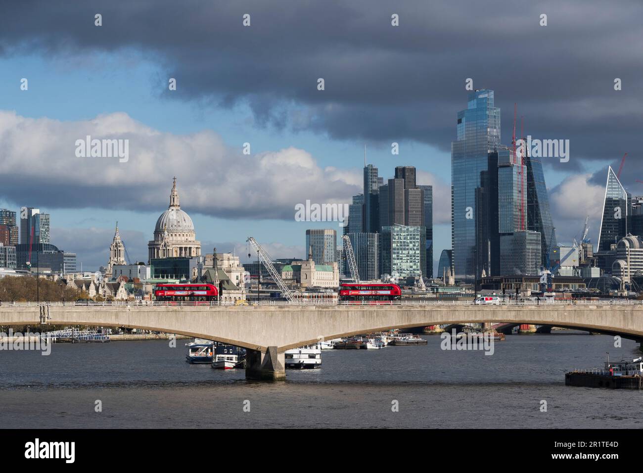 Two new Routemaster bus crossing Waterloo Bridge over the river Thames ...