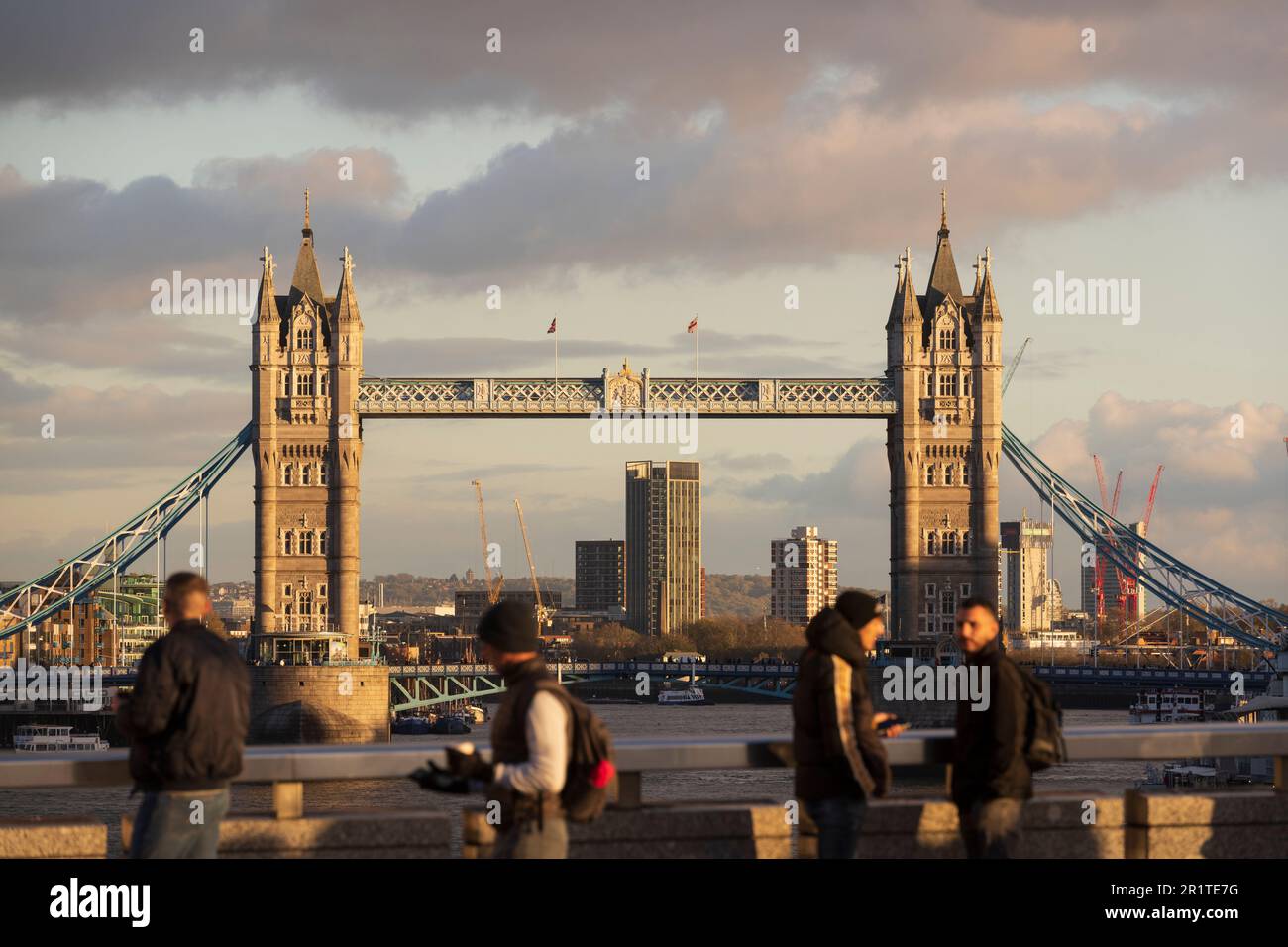 People walking across London Bridge with a view of Tower Bridge in the ...