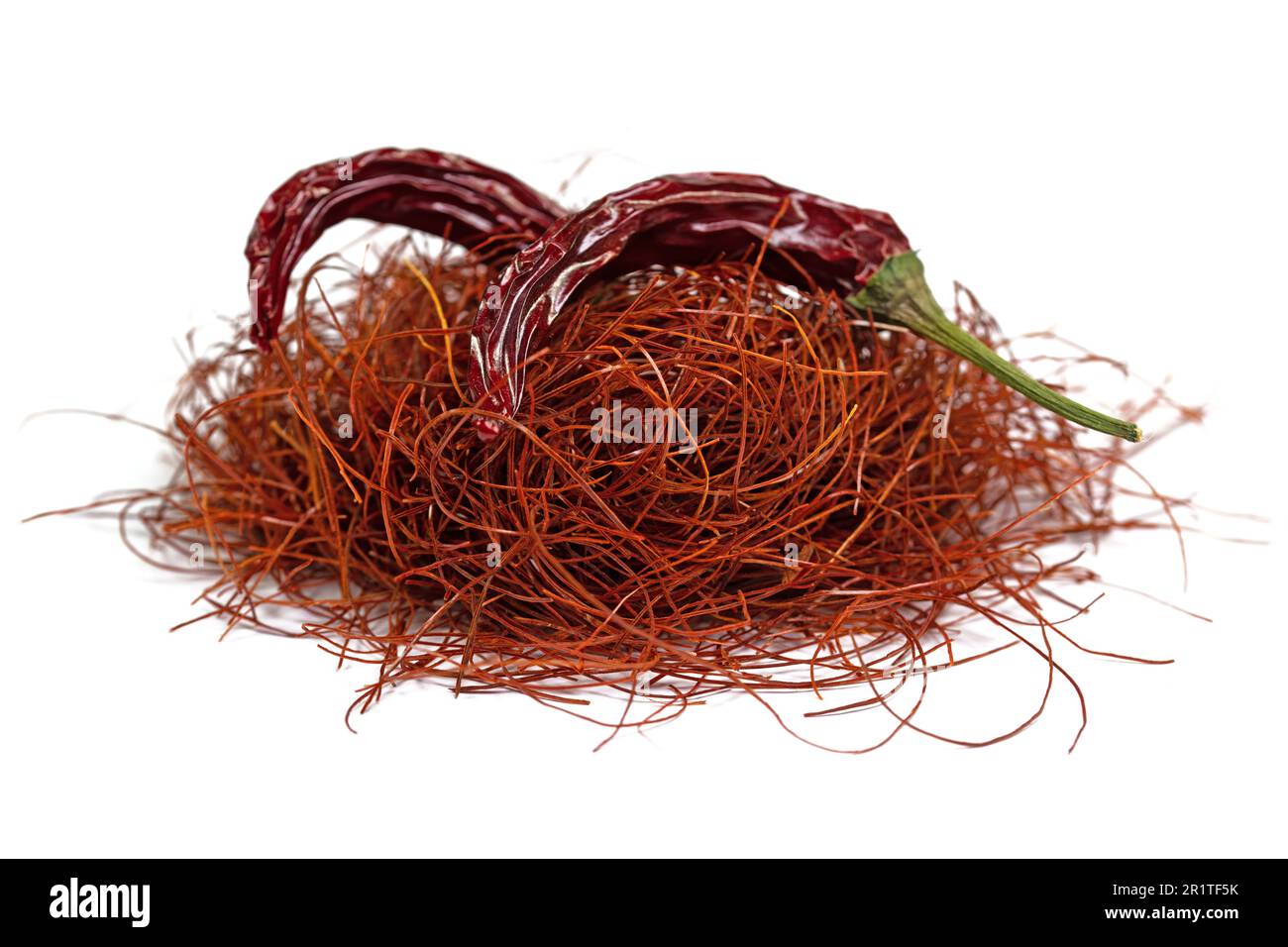 Chilli threads and chilli pod against white background Stock Photo - Alamy