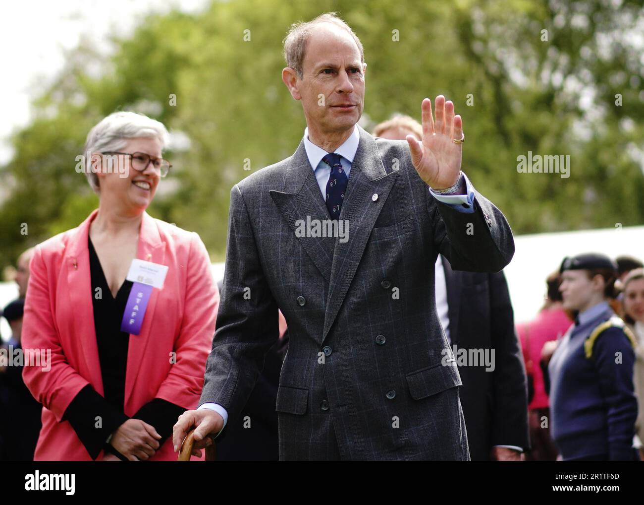 The Duke of Edinburgh waves to guests as he hosts young people from The ...