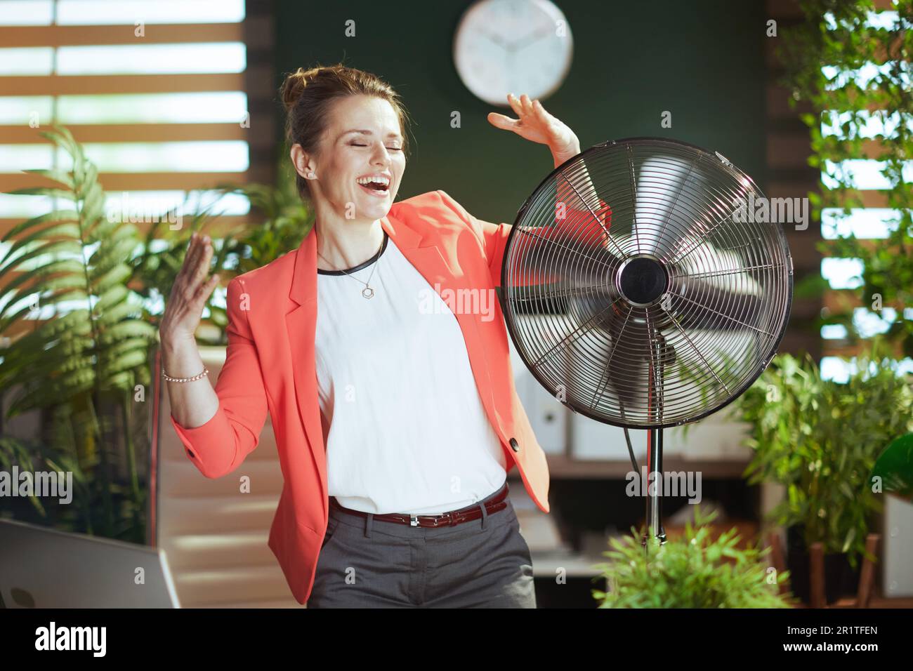Sustainable workplace. happy modern 40 years old woman employee in ...