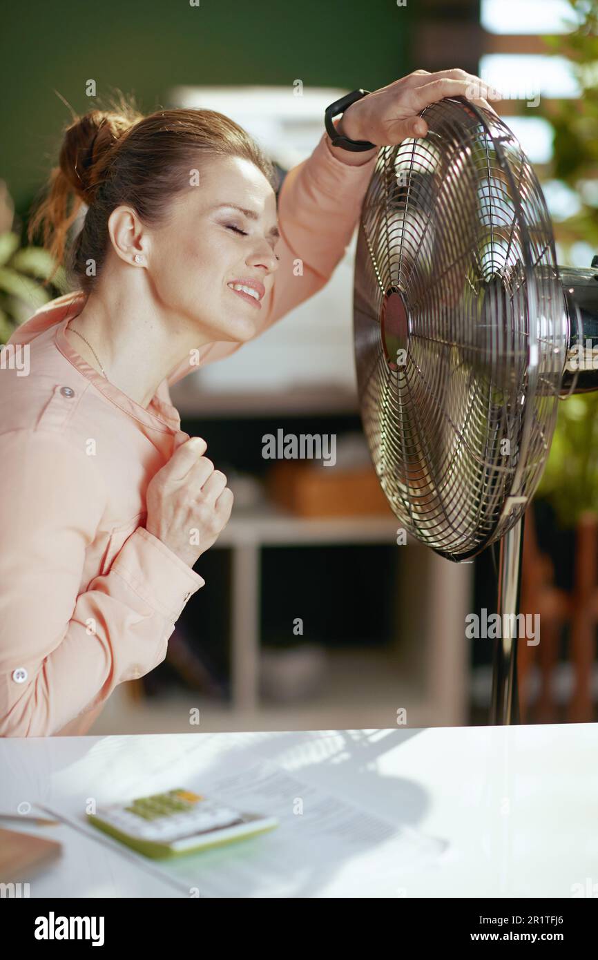 Sustainable workplace. smiling modern 40 years old woman employee at ...