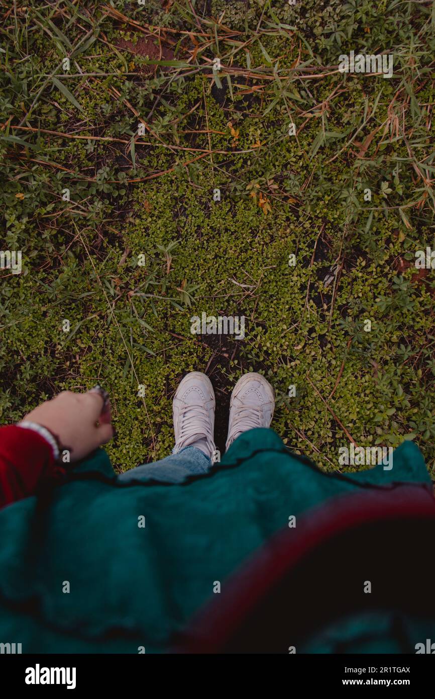 top view of feet on lawn Stock Photo - Alamy