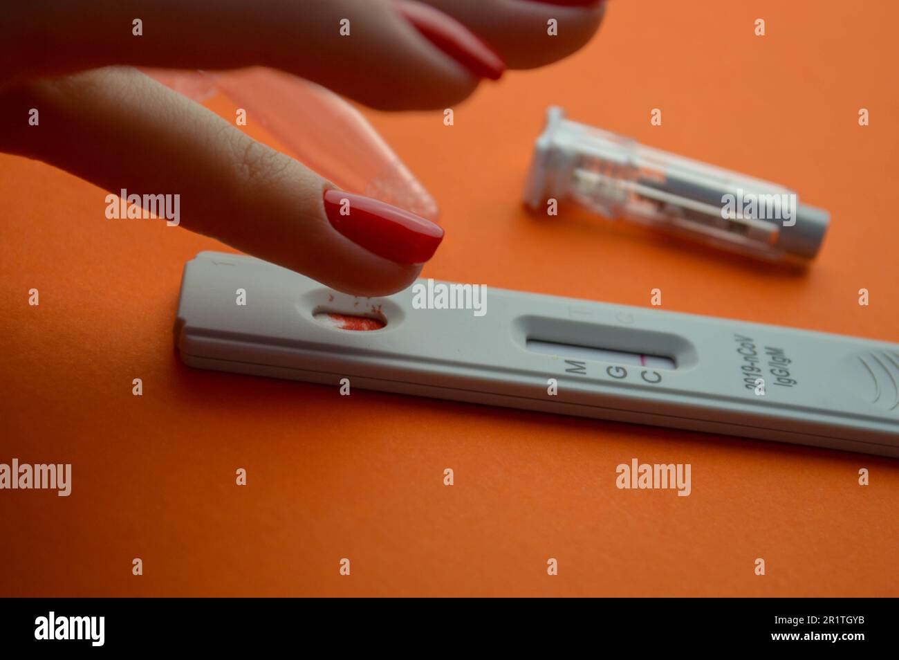 test for coronavirus on an orange background. on a matte background, a ...
