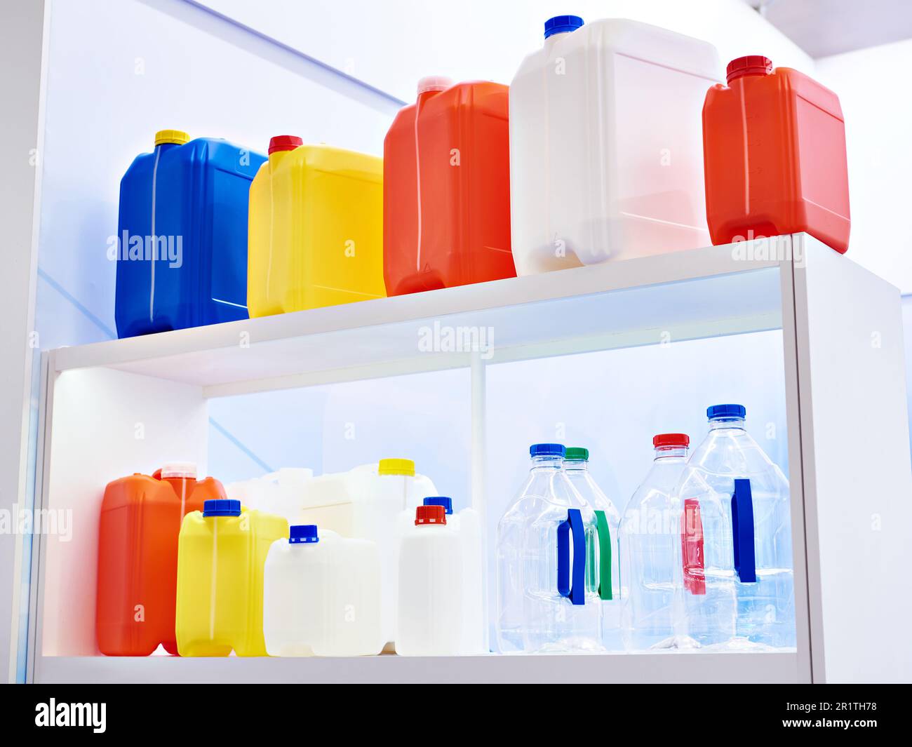 Plastic canisters at the store exhibition Stock Photo - Alamy