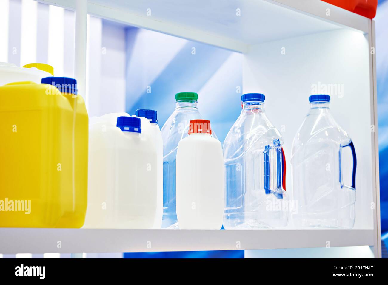 Plastic canisters at the store exhibition Stock Photo - Alamy