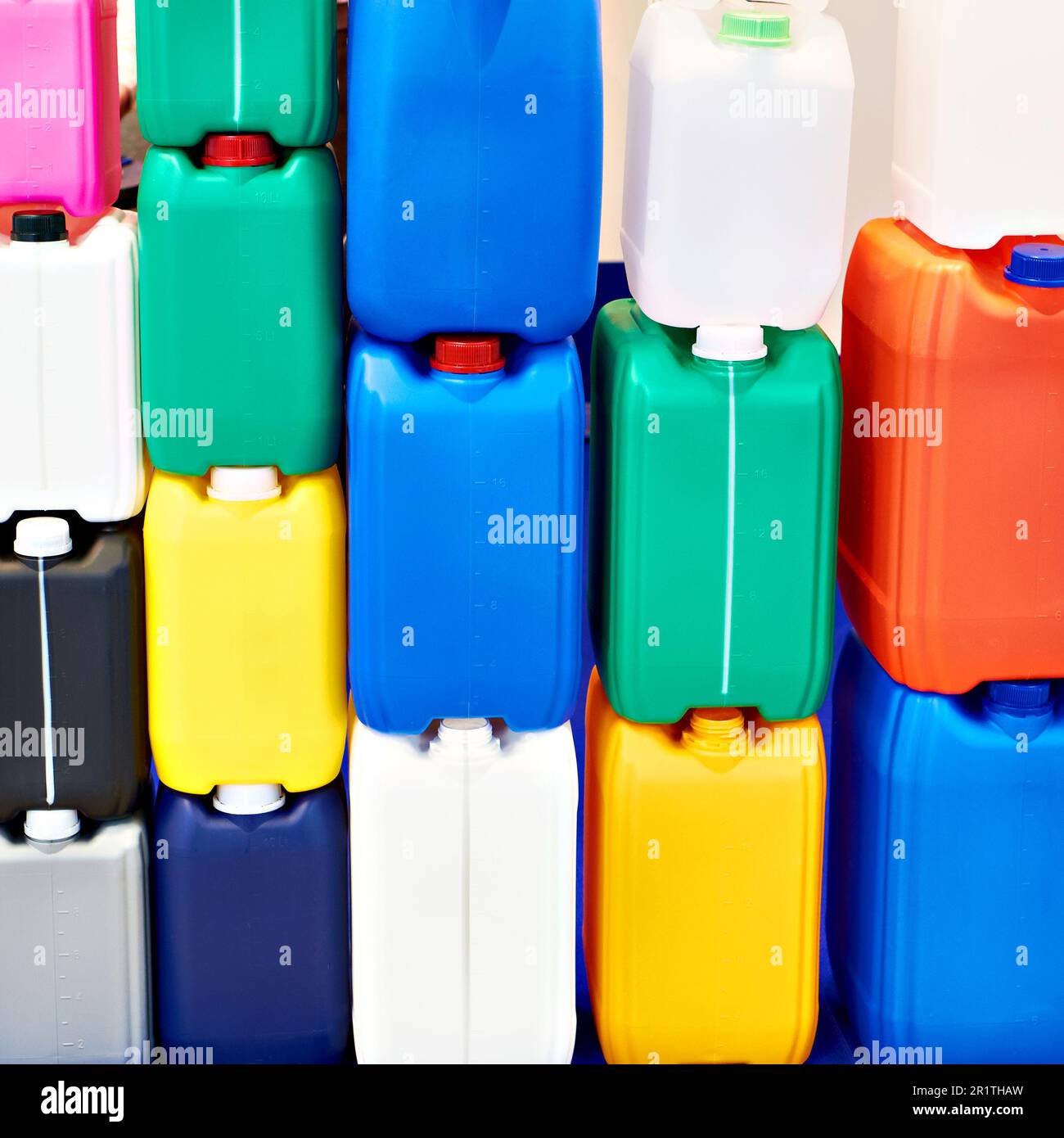 Colored plastic canisters at store Stock Photo - Alamy
