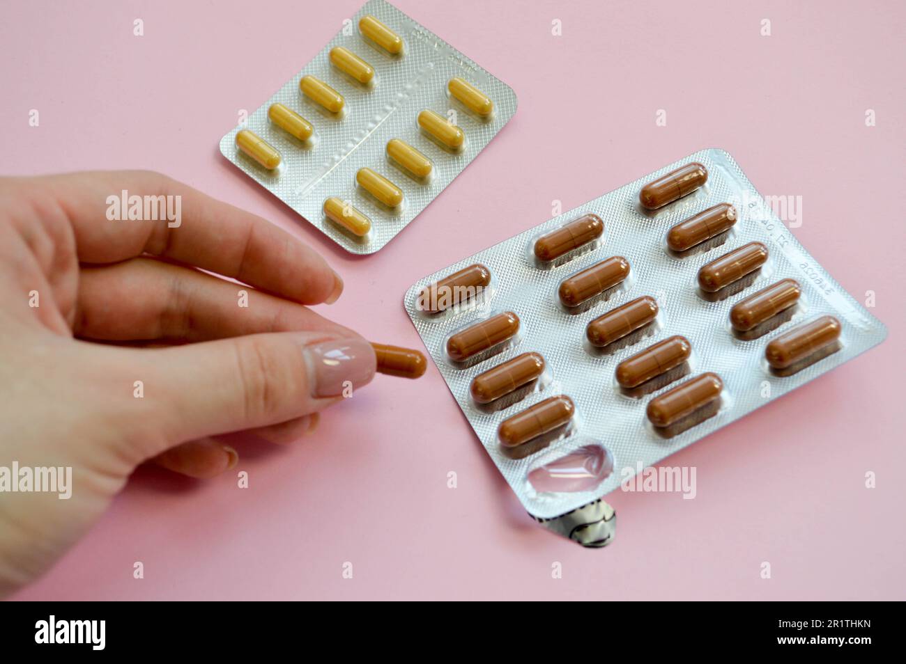 Taking capsule tablets hi-res stock photography and images - Alamy