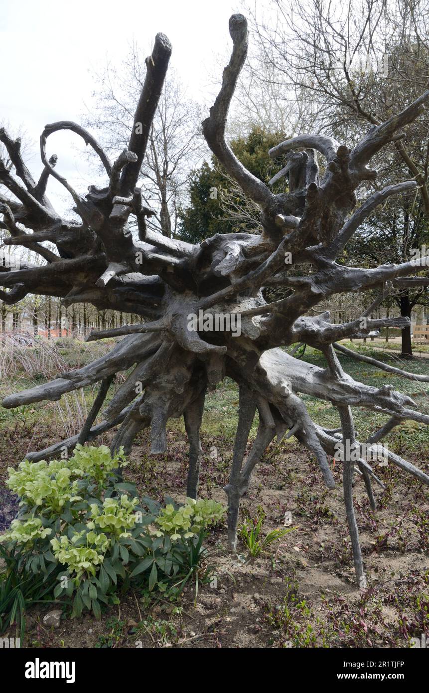 Paris, France - March 20, 2023: Roots of bronze sculpture of a fallen ...