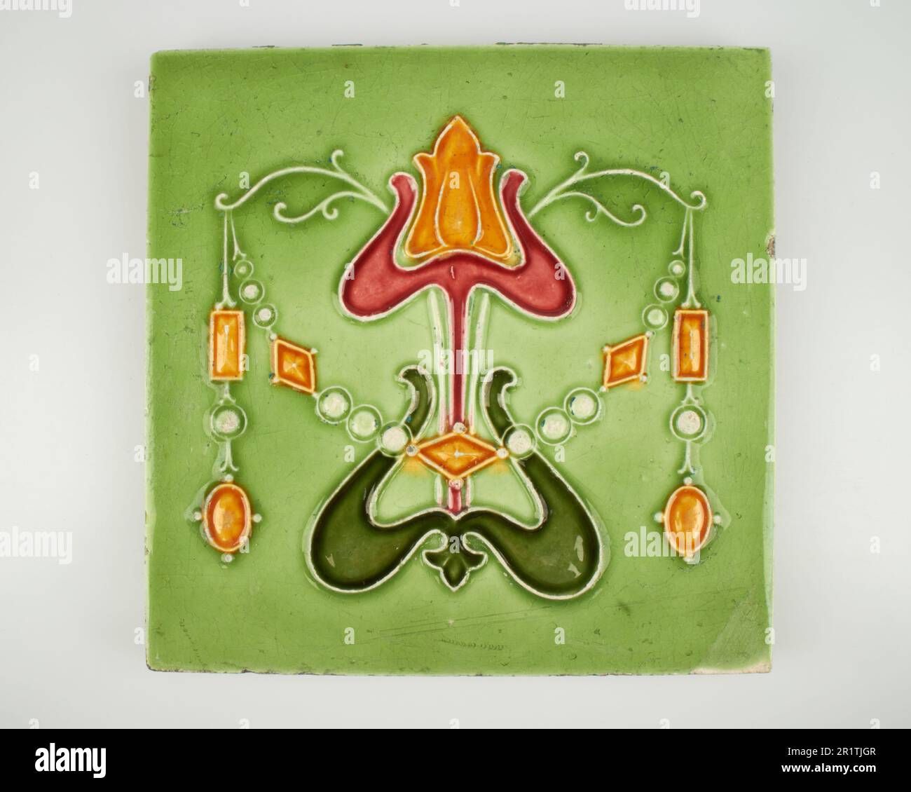 Antique 1900s Minton Art Nouveau amber and red tulip pottery tile Stock ...